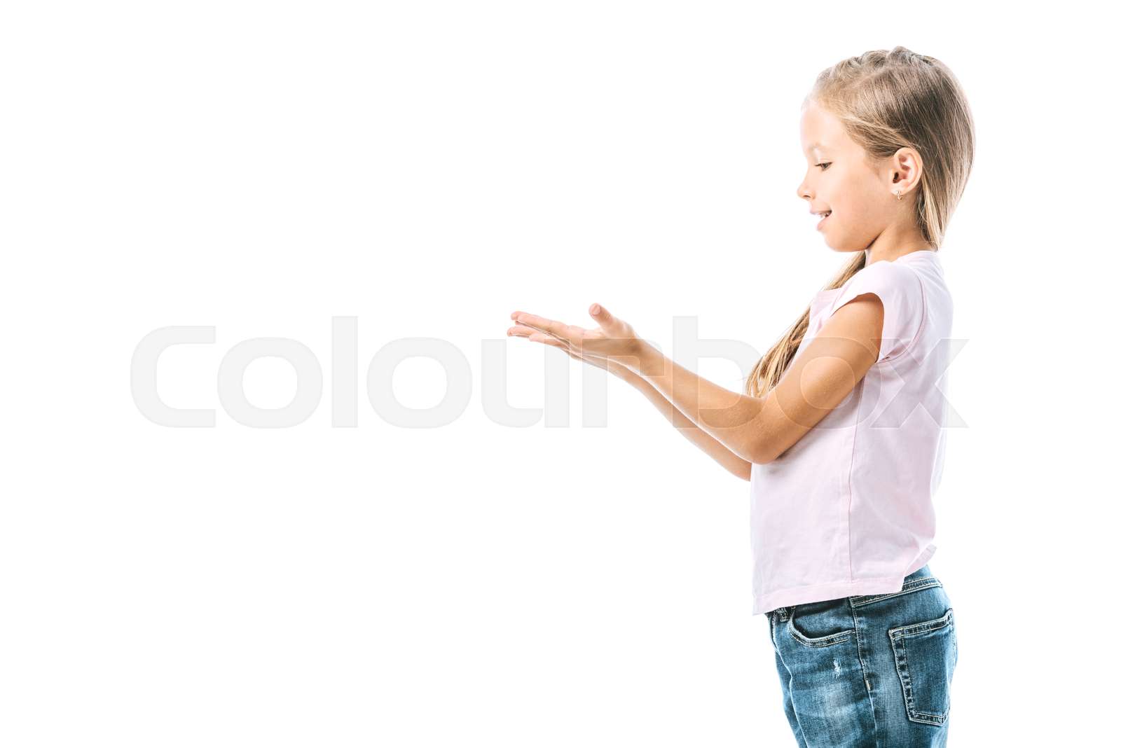 side view of positive and cute kid pointing with hands isolated on ...