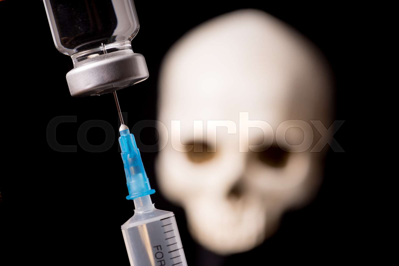 One single Syringe with liquid and skull | Stock image | Colourbox