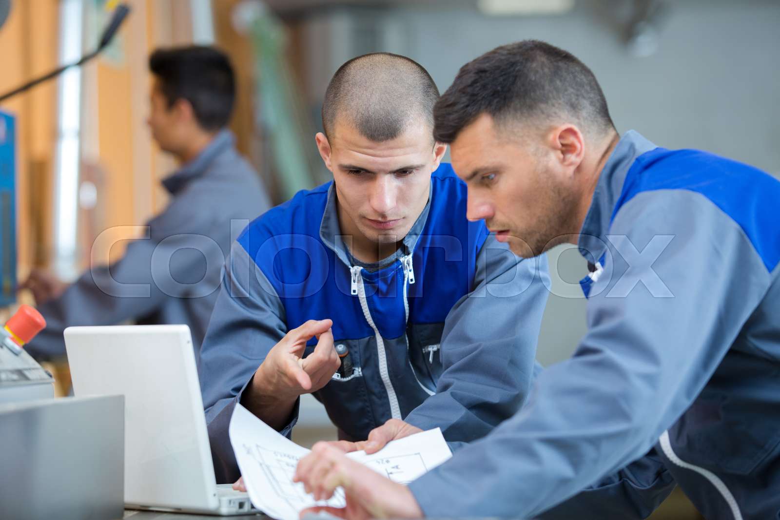 boss and worker on work bench | Stock image | Colourbox