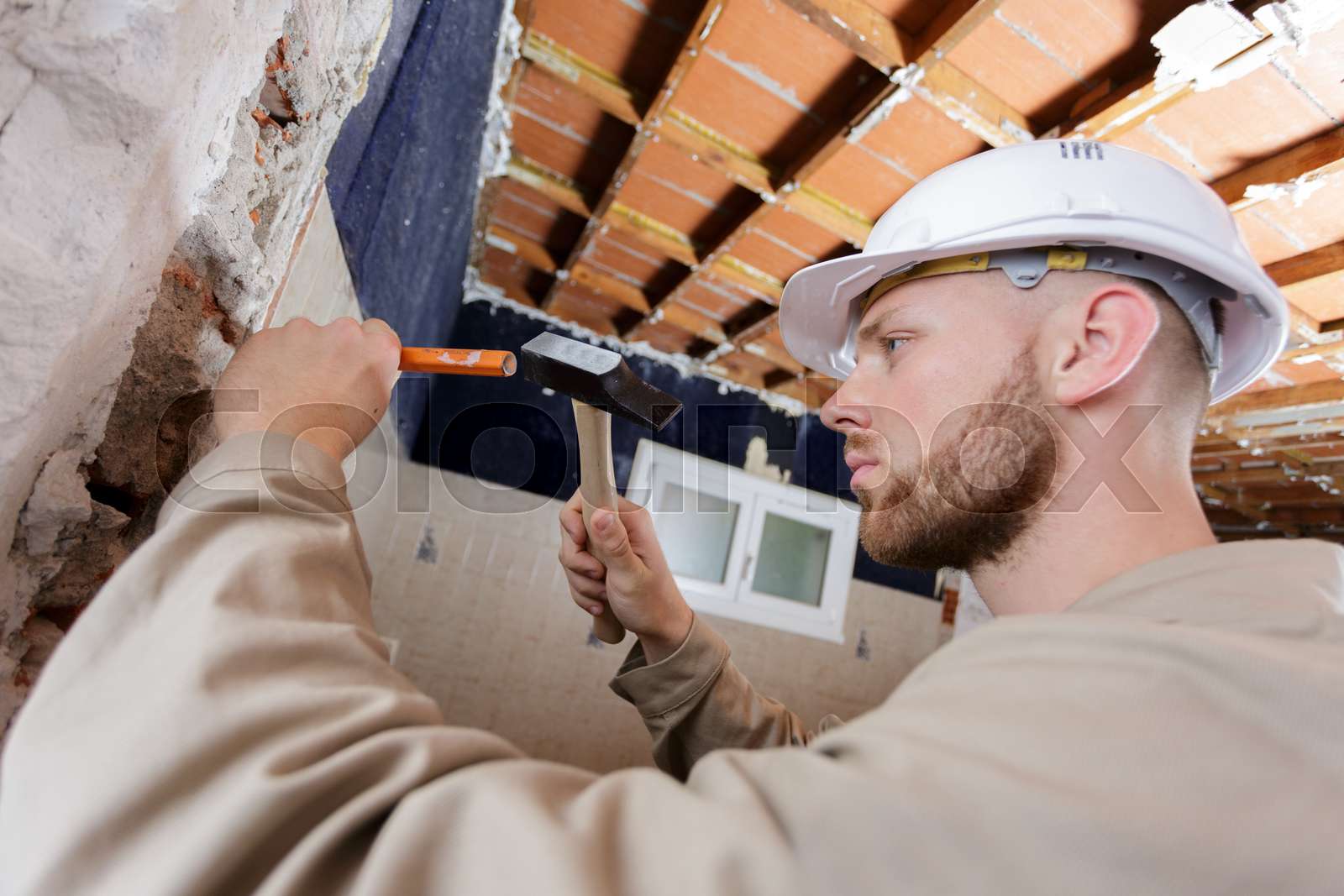 man with a hammer and chisel | Stock image | Colourbox