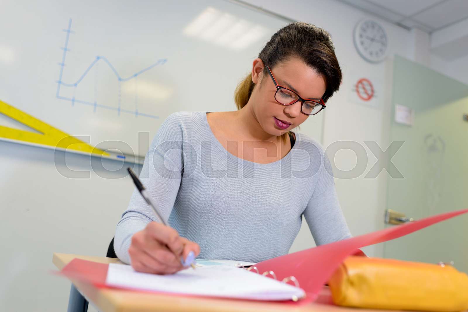 class teacher preparing her lessons | Stock image | Colourbox