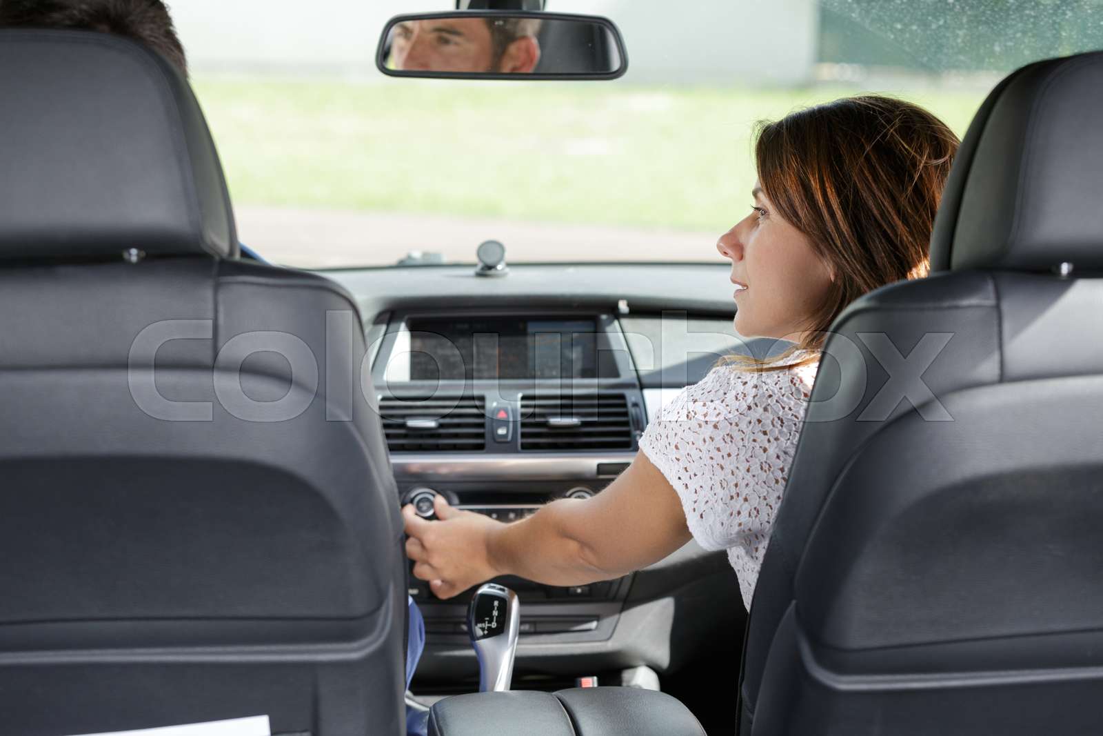 woman touching the dashboard inside of a car | Stock image | Colourbox