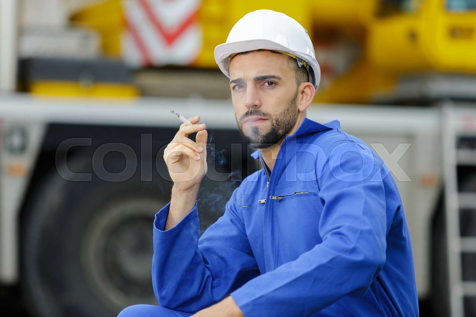 manual worker smoking a cigarette | Stock image | Colourbox