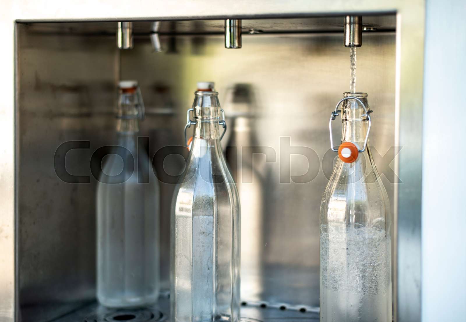Mineral Water machine on the street. Pay and load drinking water ...