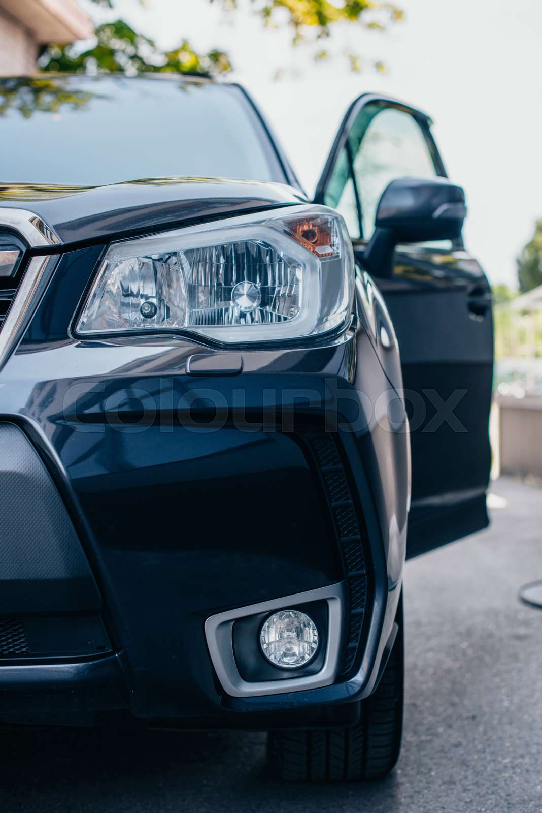 front view of black, modern polished car with open door | Stock image ...