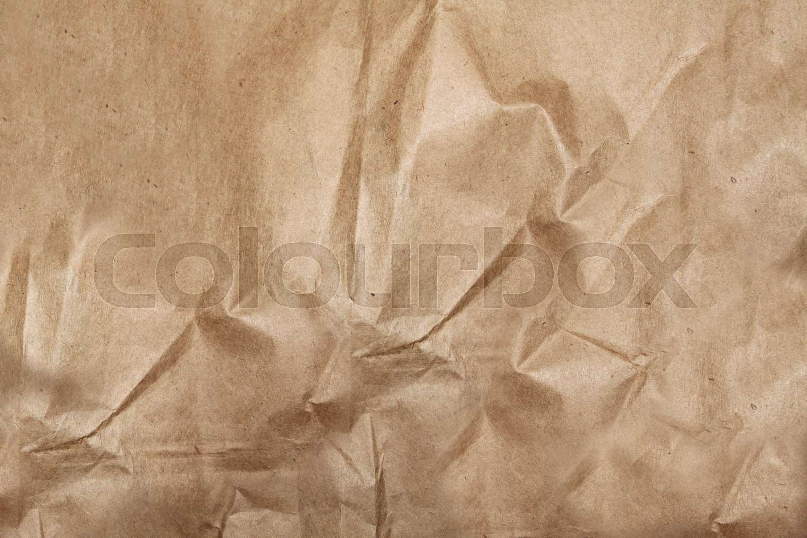 Heavily dented beige paper.Texture.Background. | Stock image | Colourbox