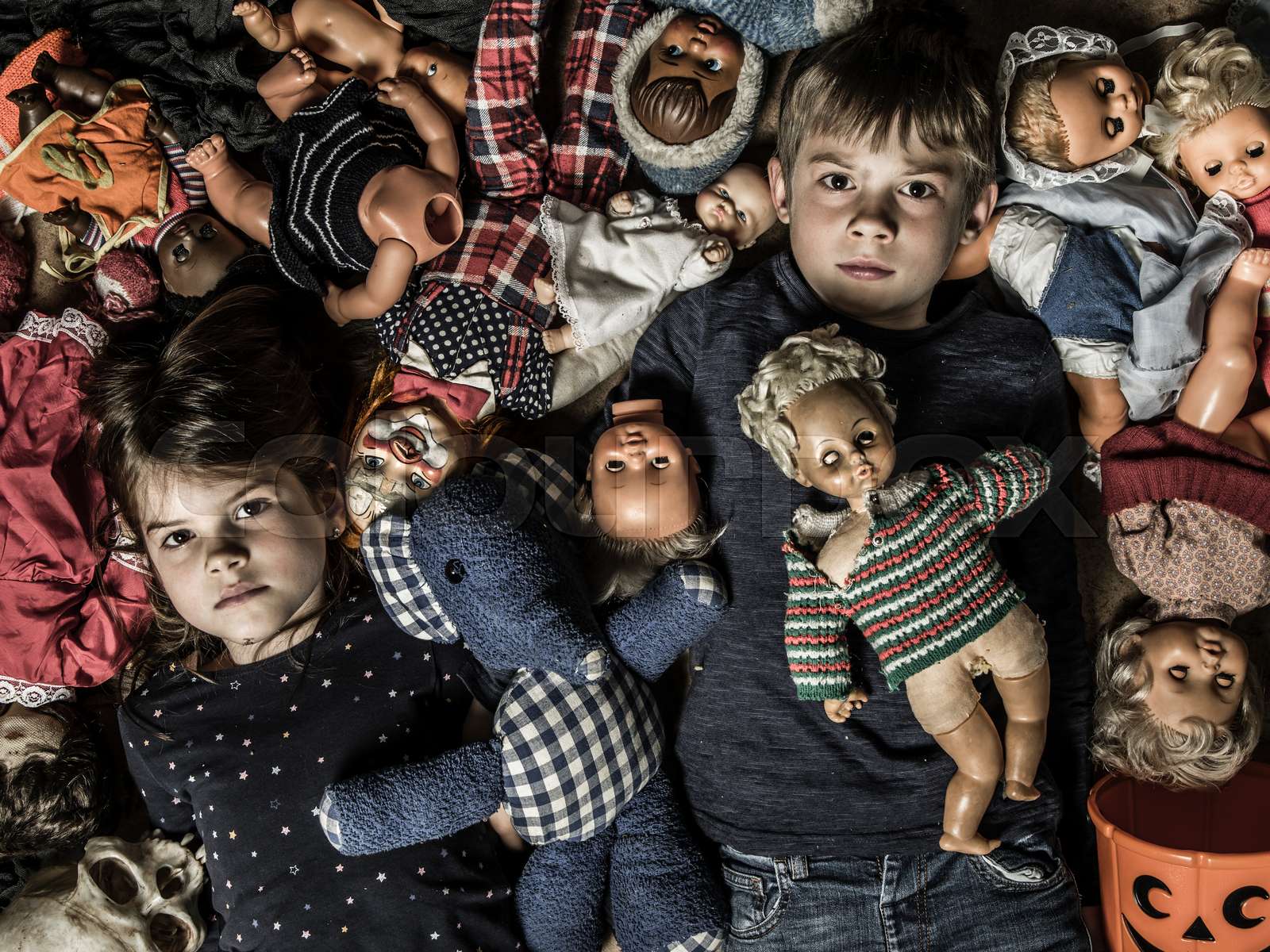 Creepy children with scary dolls | Stock image | Colourbox