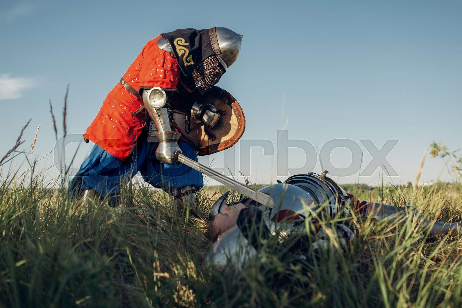 Knight put his sword to his opponent's throat | Stock image | Colourbox