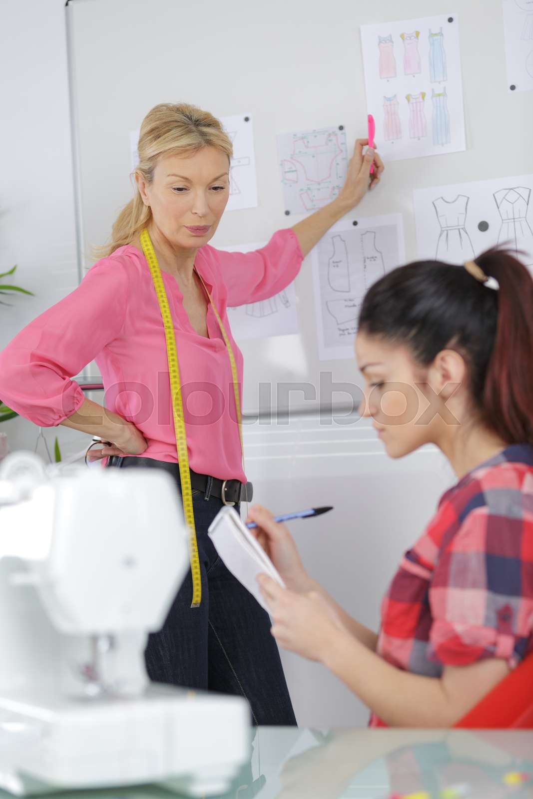 brainstorming session in a fashion designers studio | Stock image ...