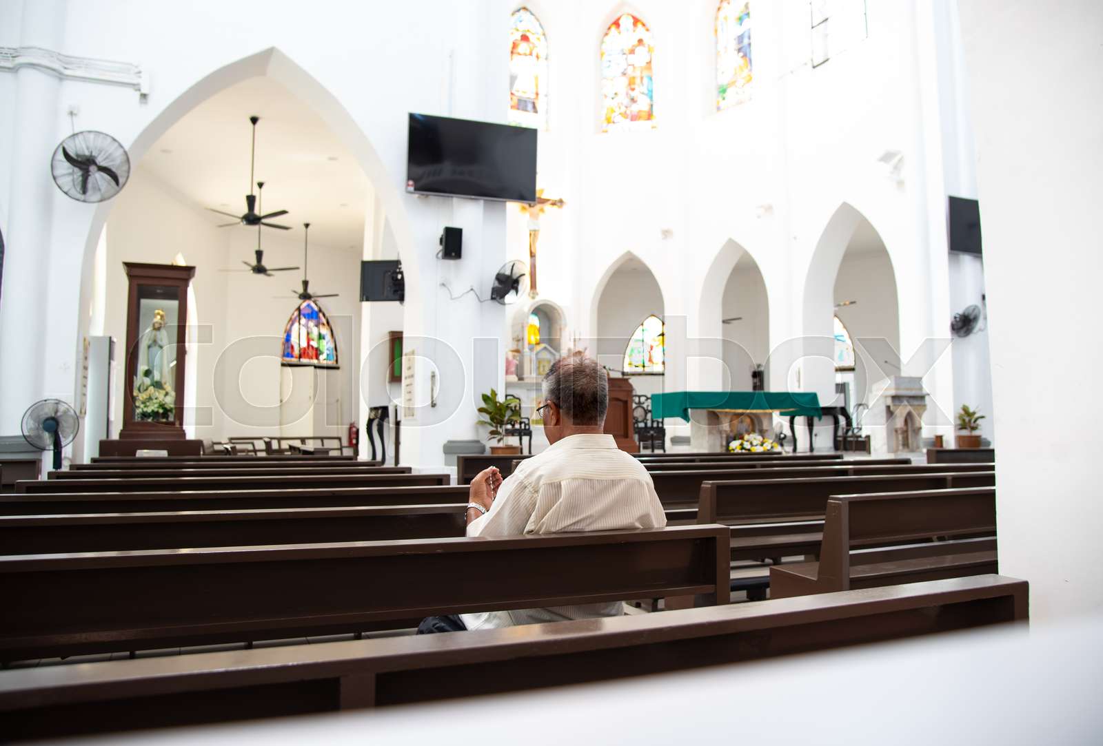 Man in church | Stock image | Colourbox