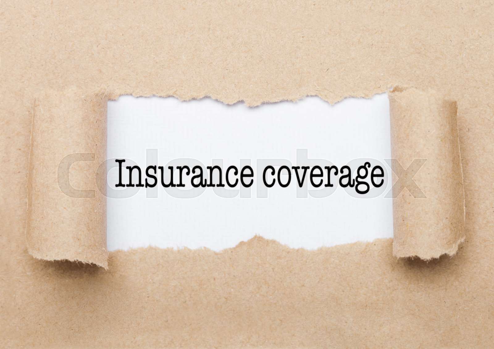 Insurance coverage text appearing behind paper | Stock image | Colourbox