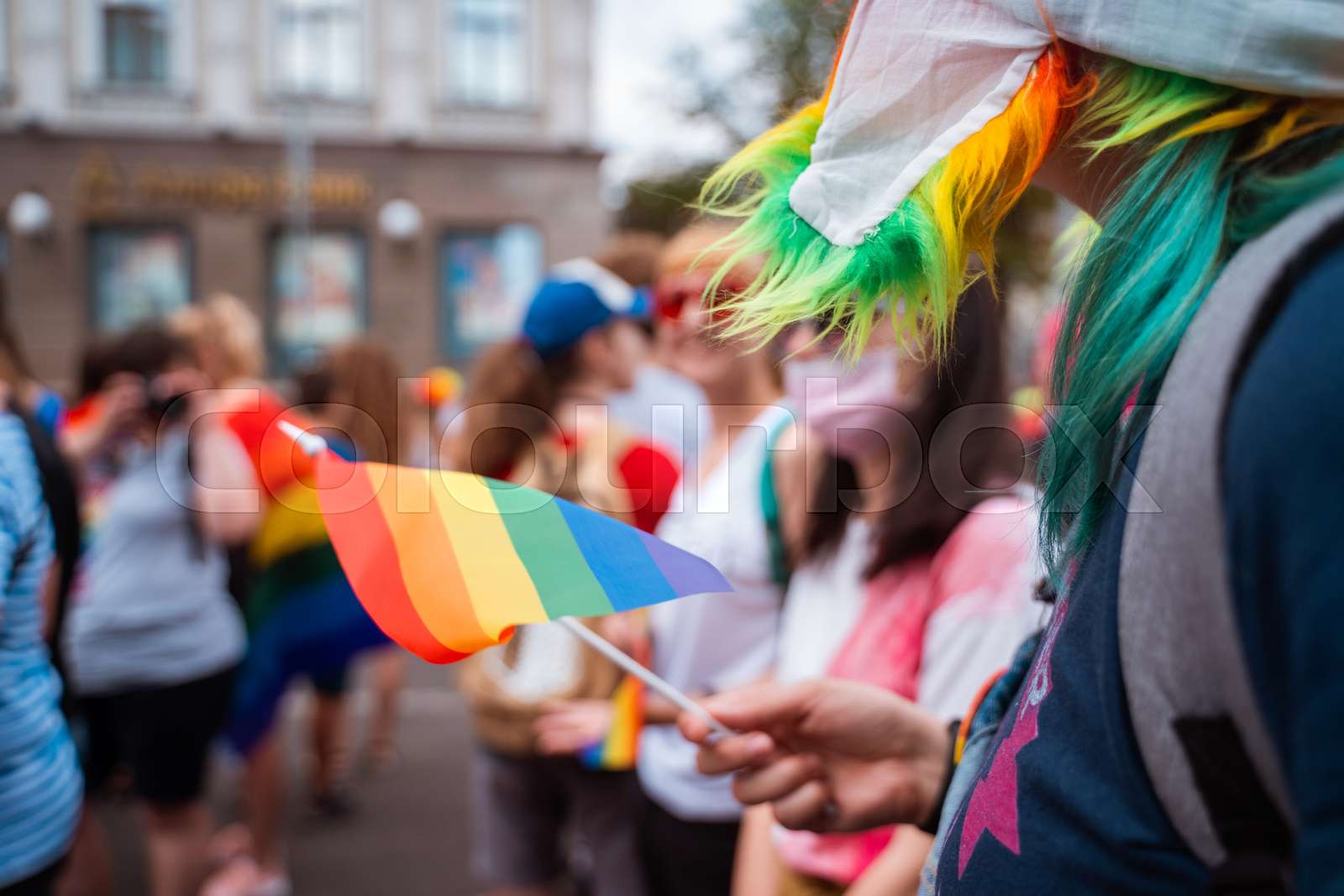 Happy crowd waving lgbt flags during Pride Parade | Stock image | Colourbox