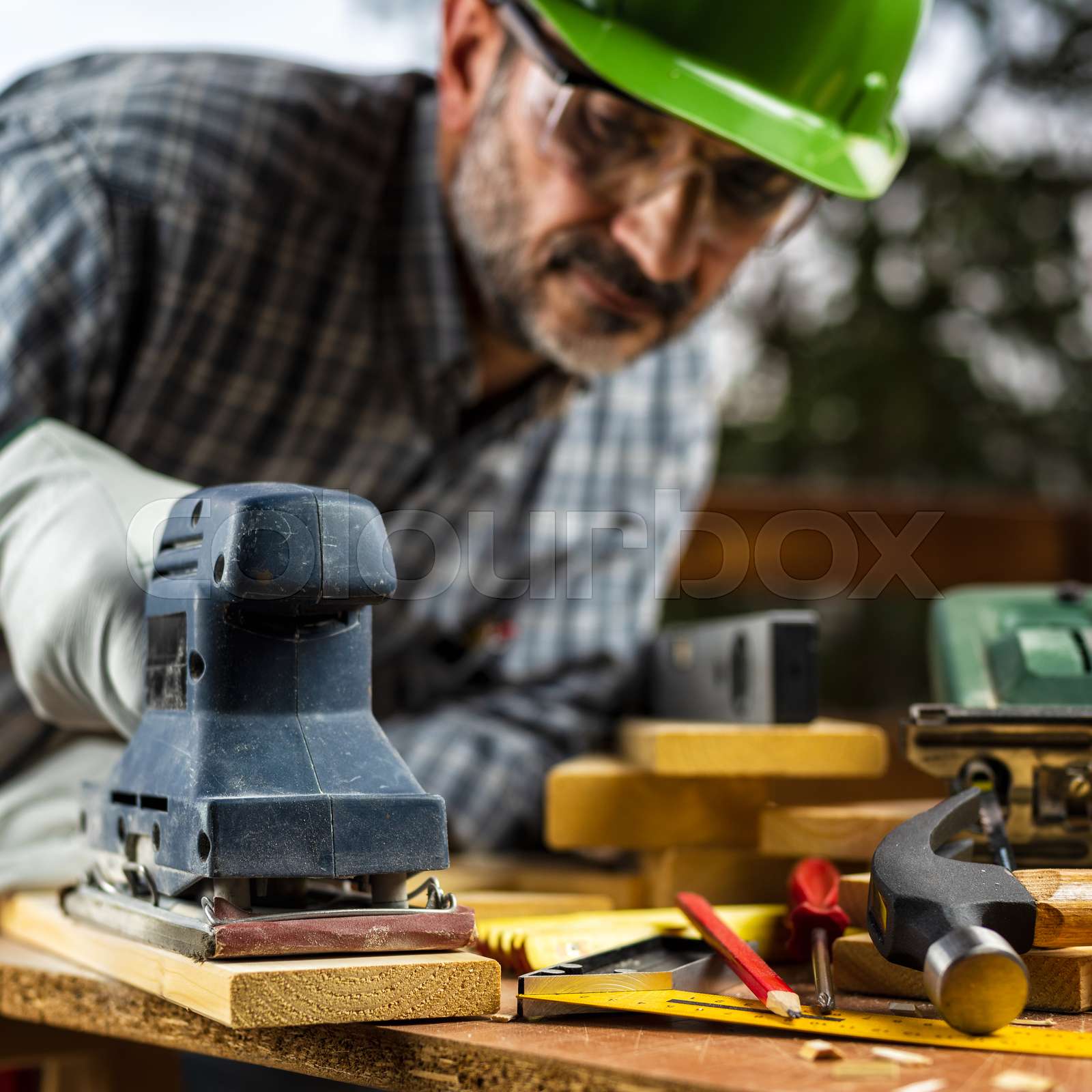 Craftsman at work on wooden boards. Carpentry. | Stock image | Colourbox