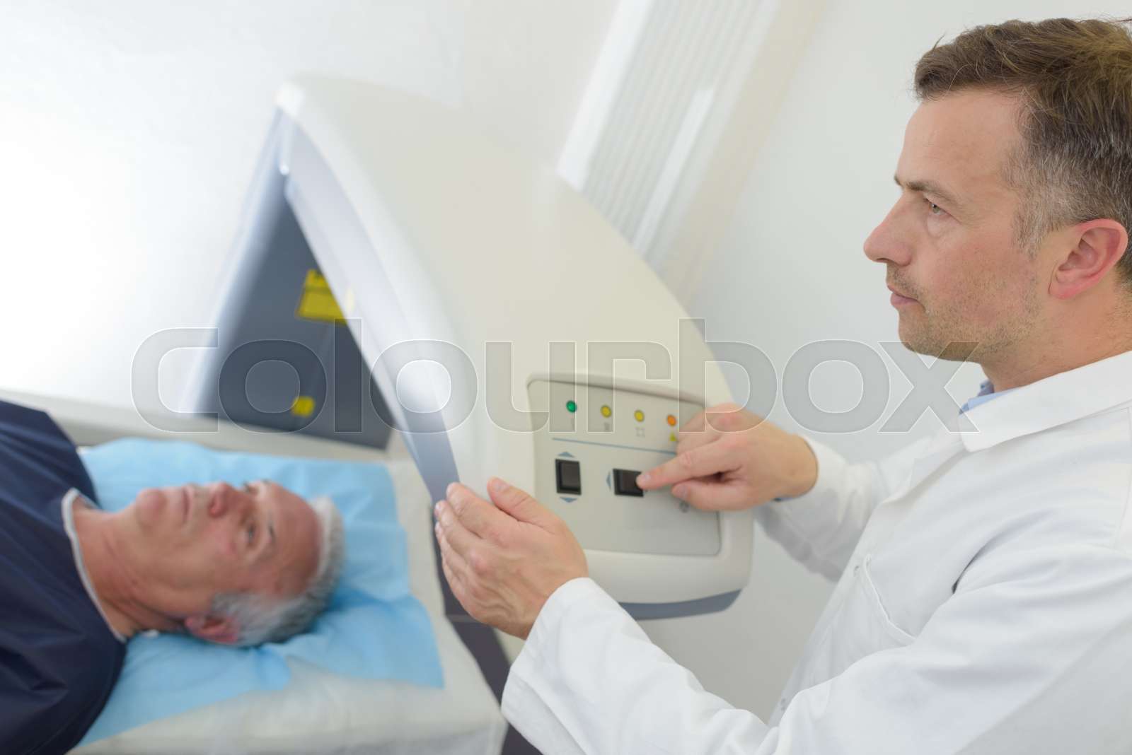 man in 70s undergoing x-ray scan | Stock image | Colourbox
