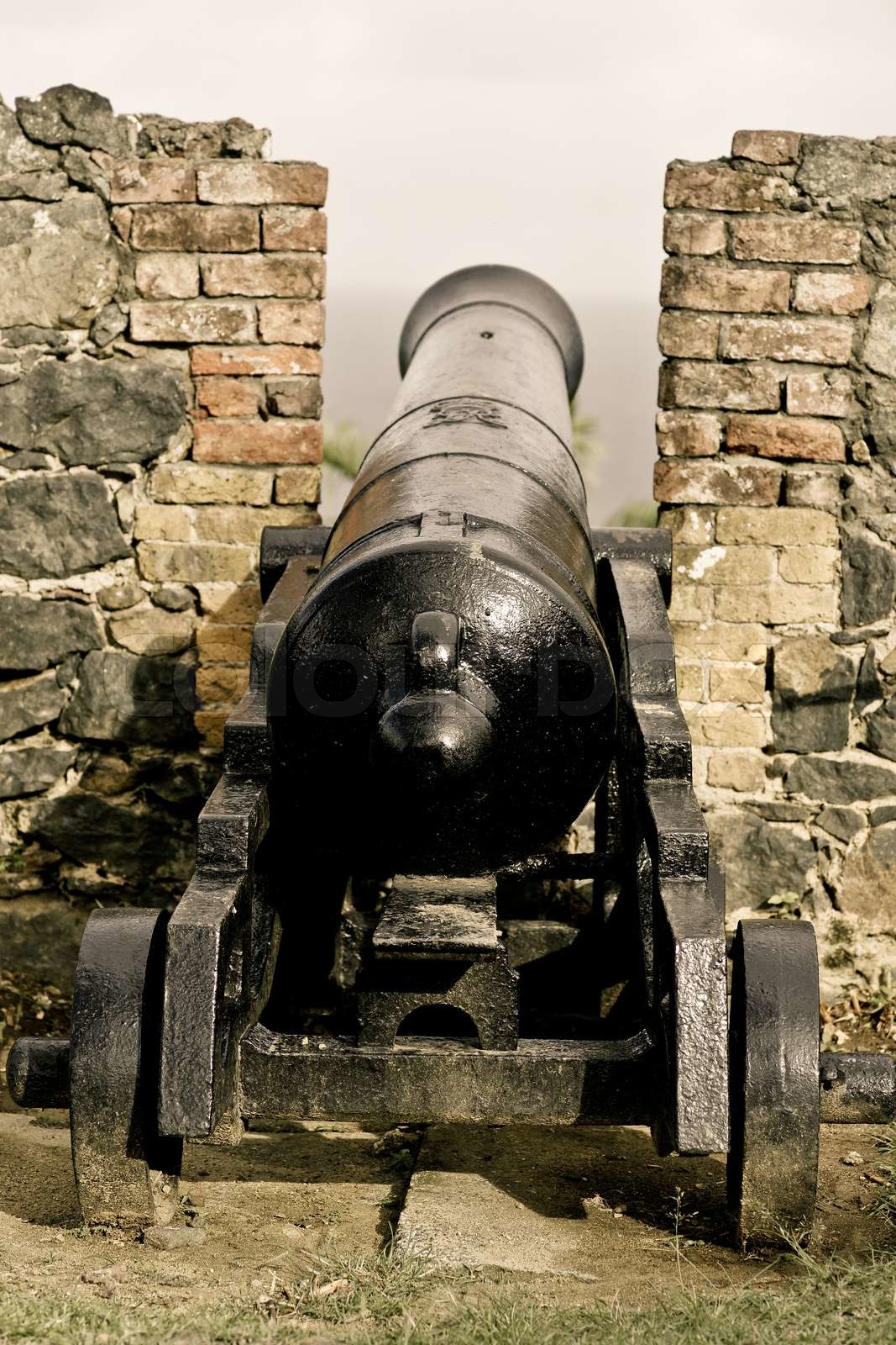 Cannon on a fort by a brick wall | Stock image | Colourbox