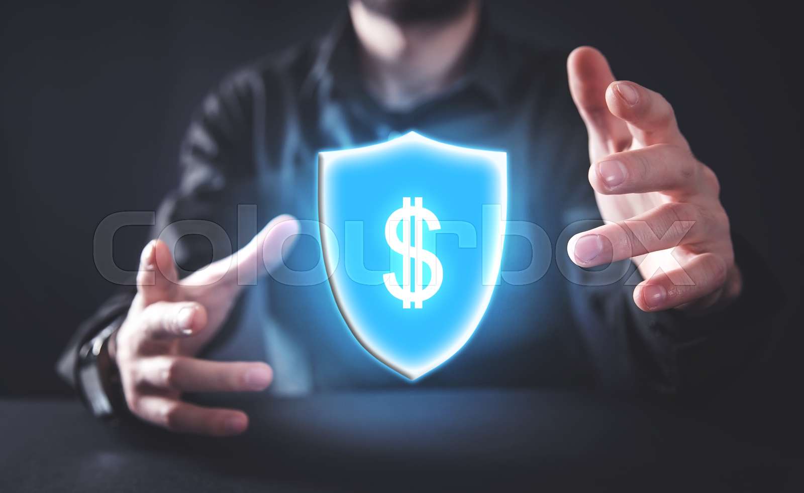 Man protect shield Dollar sign. Money protection | Stock image | Colourbox