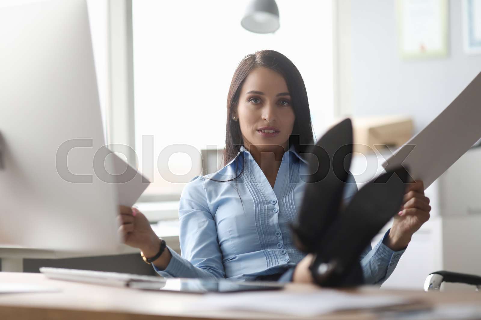 Busy woman at workplace | Stock image | Colourbox