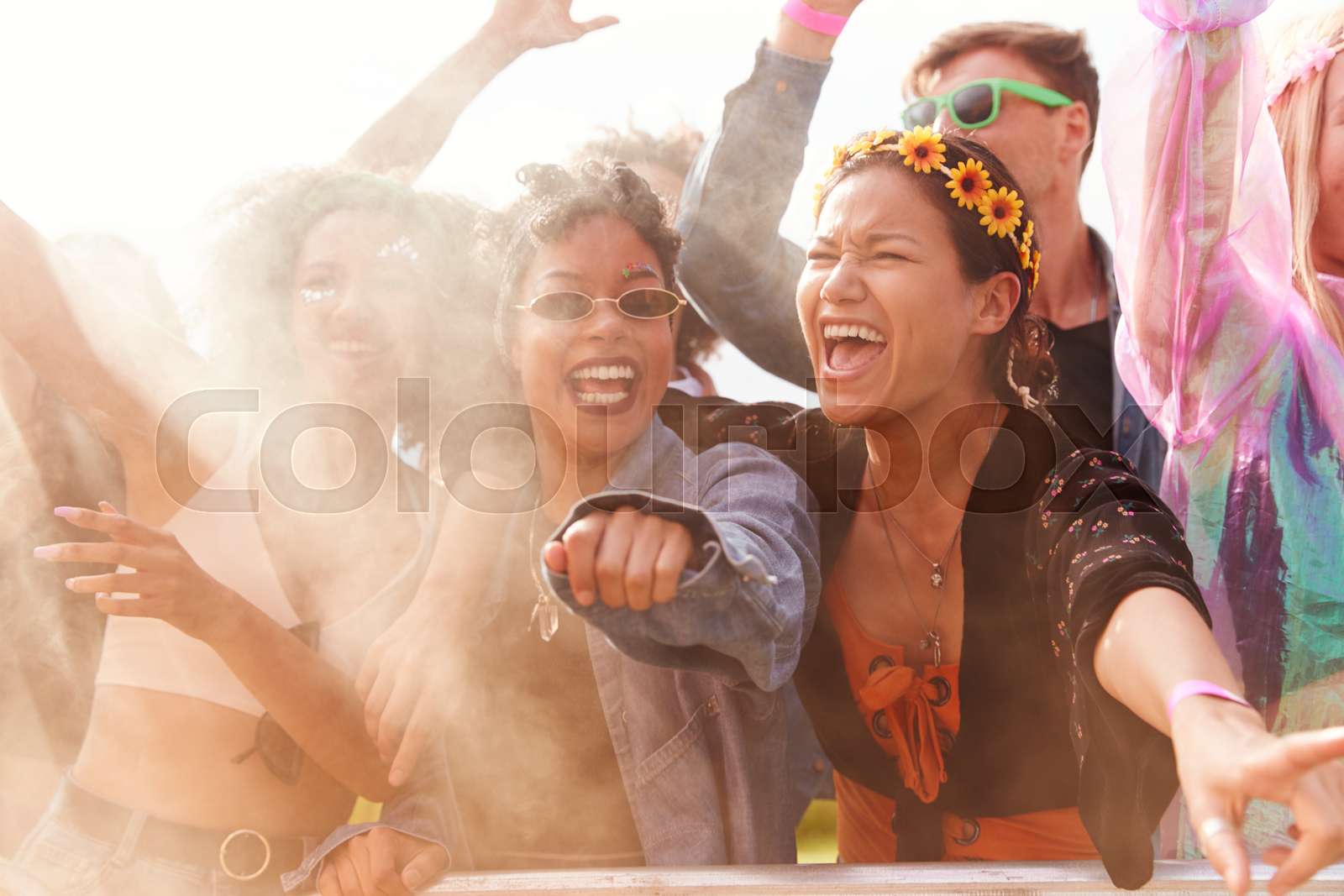 Audience With Colored Smoke Behind Barrier Dancing And Singing At ...