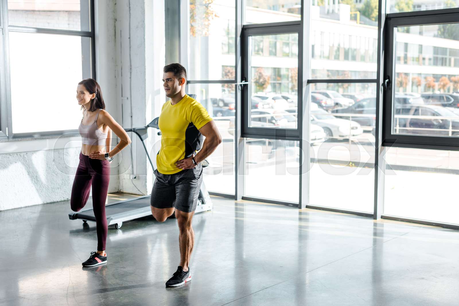 sportsman and sportswoman working out together in sports center | Stock ...