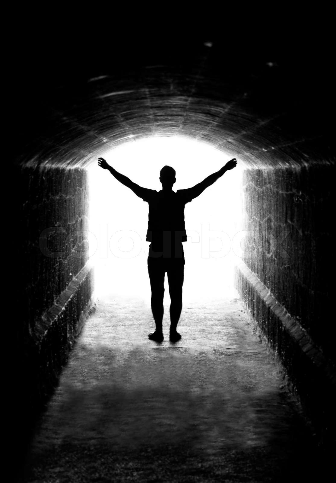 Human silhouette in tunnel exit | Stock image | Colourbox