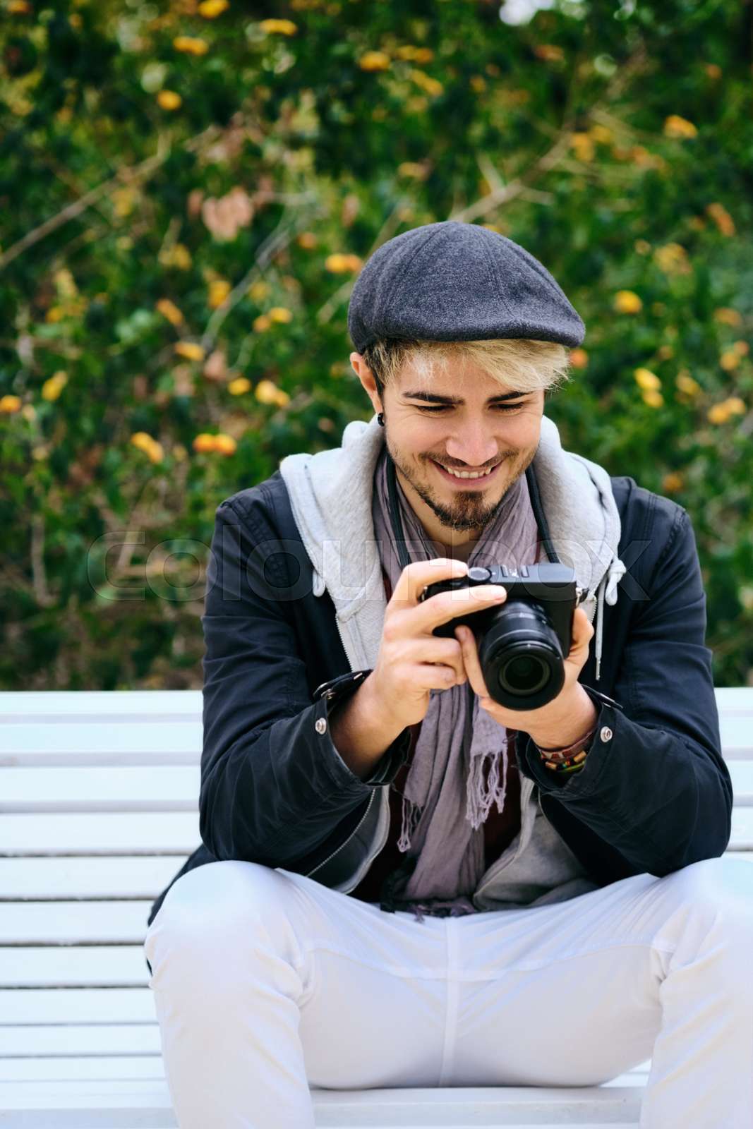 Hipster Street Photographer Reviewing Pictures On Mirrorless Camera ...