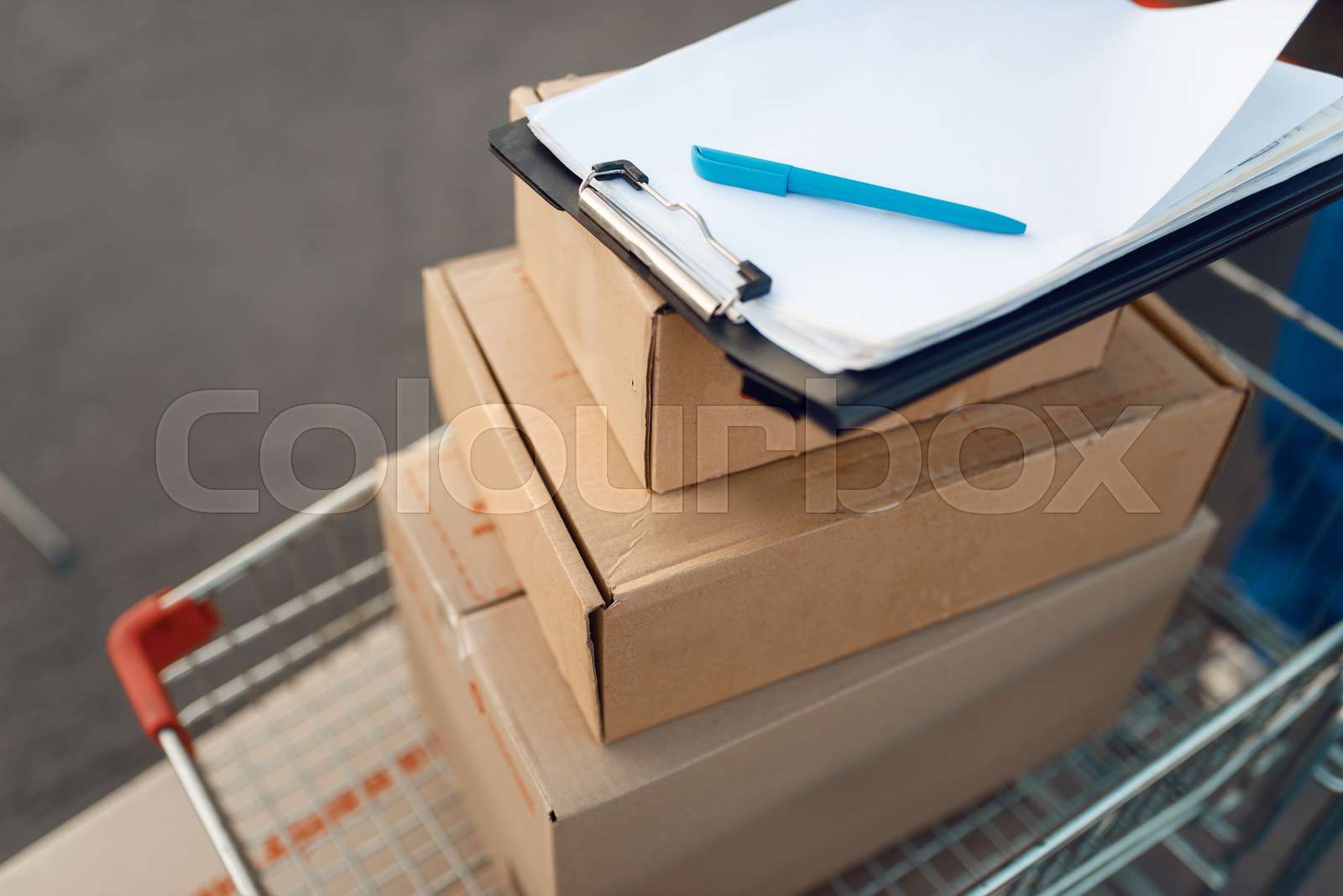 Parcel boxes in cargo cart, delivery service | Stock image | Colourbox