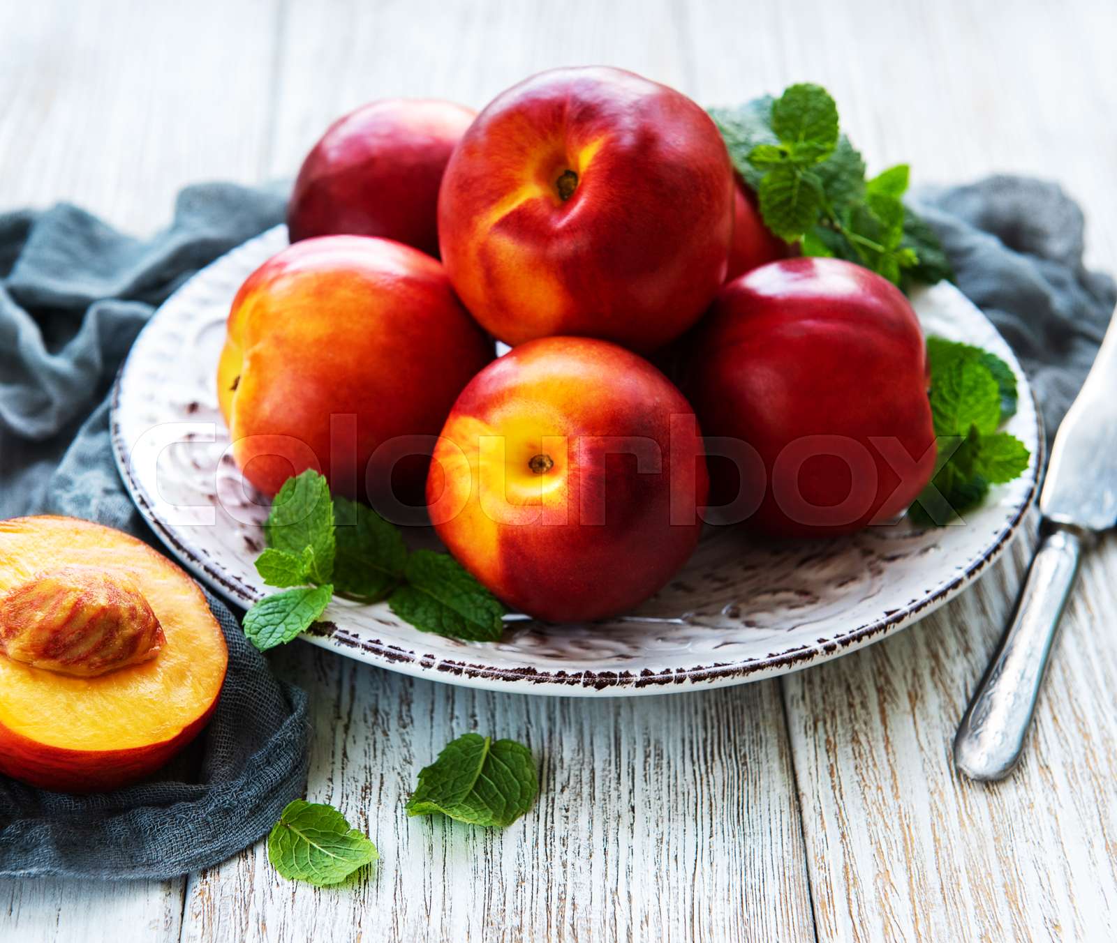 Plate with fresh nectarines | Stock image | Colourbox