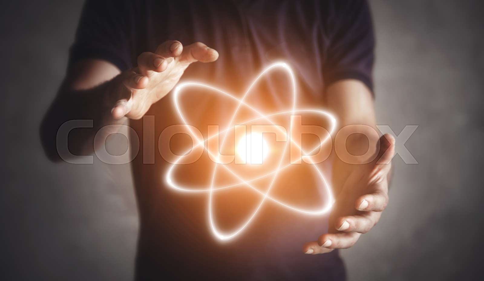 Man holding atom. Energy. Science. Connection - Stock Image - Everypixel