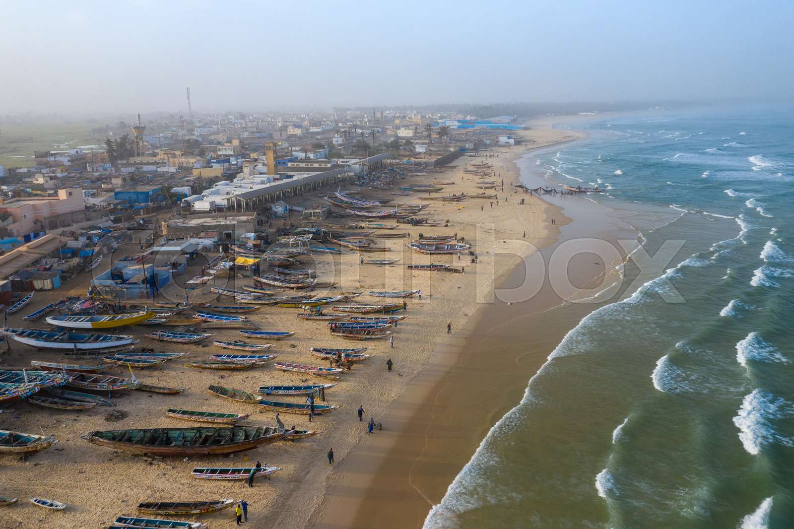 Aerial view of fishing village, pirogues fishing boats in Kayar ...
