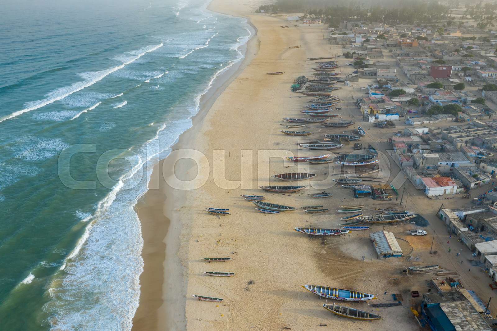 Aerial view of fishing village, pirogues fishing boats in Kayar ...