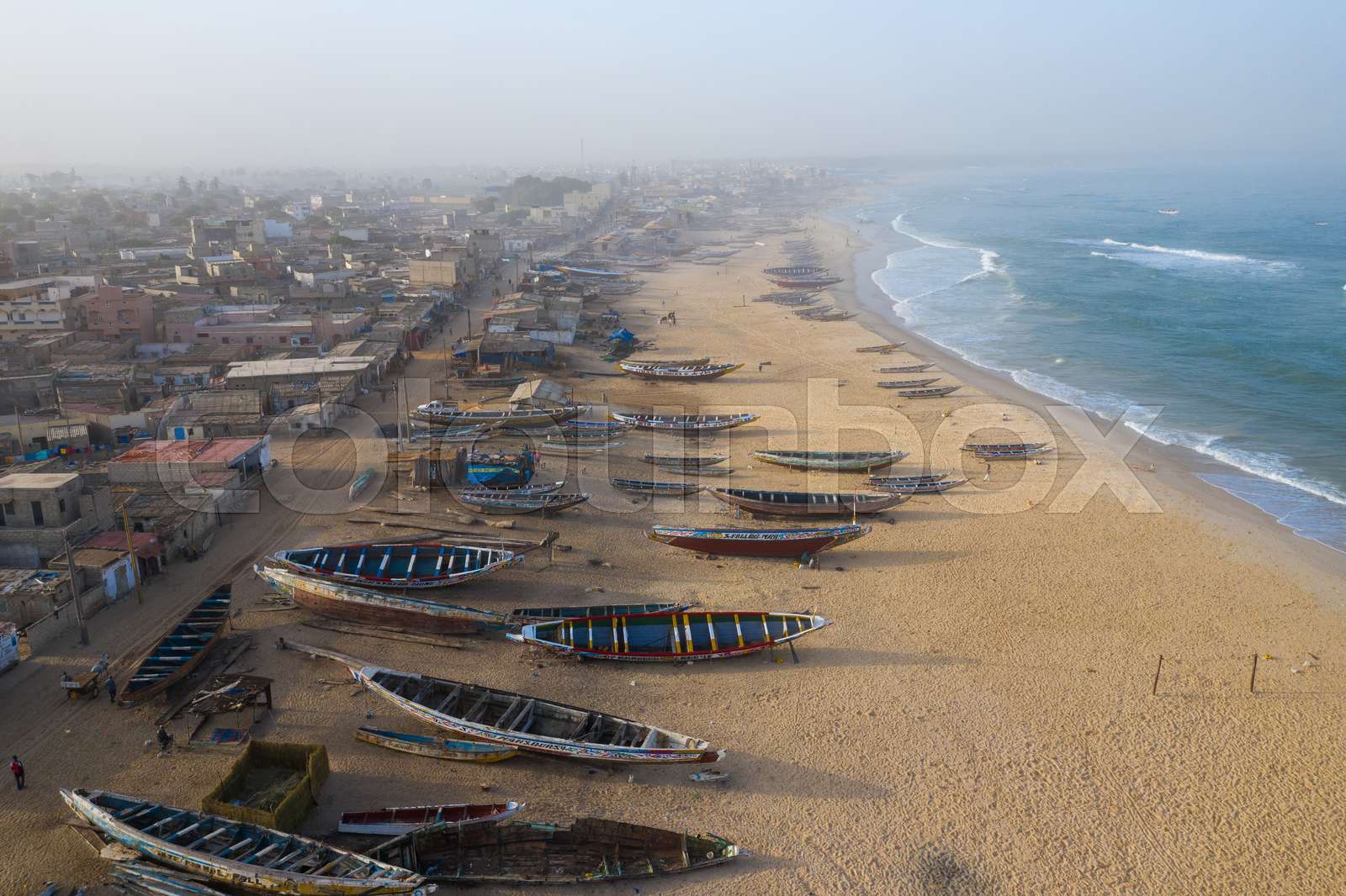 Aerial view of fishing village, pirogues fishing boats in Kayar ...