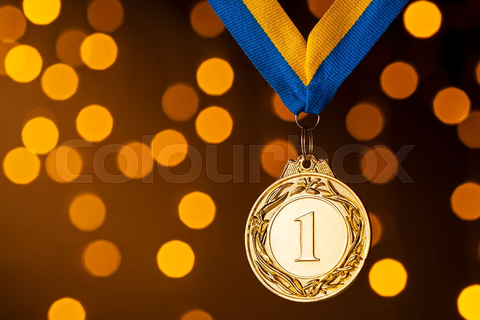 Gold champion or winners medallion on a ribbon | Stock image | Colourbox
