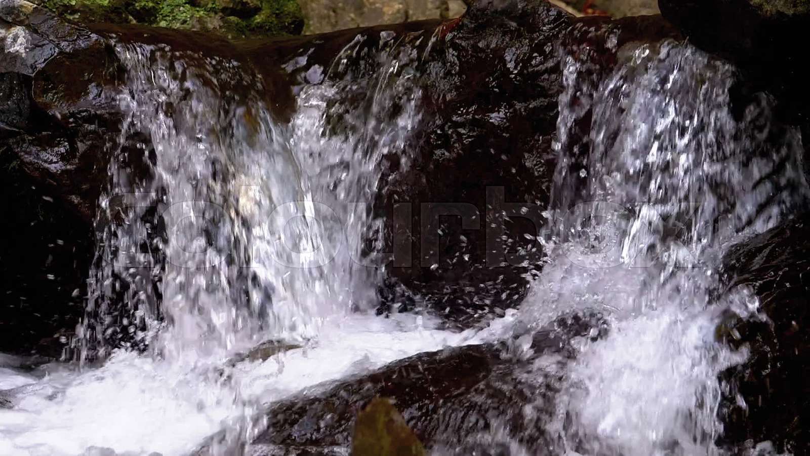 Mountain Creek. Water moves down through Rocks in the Mountains | Stock ...