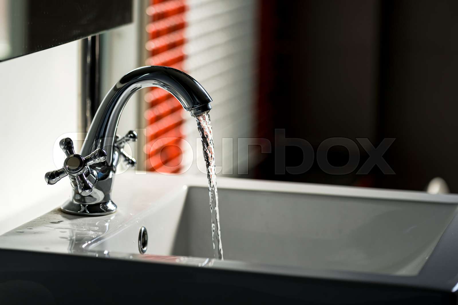 Faucet and water flow on bathroom | Stock image | Colourbox