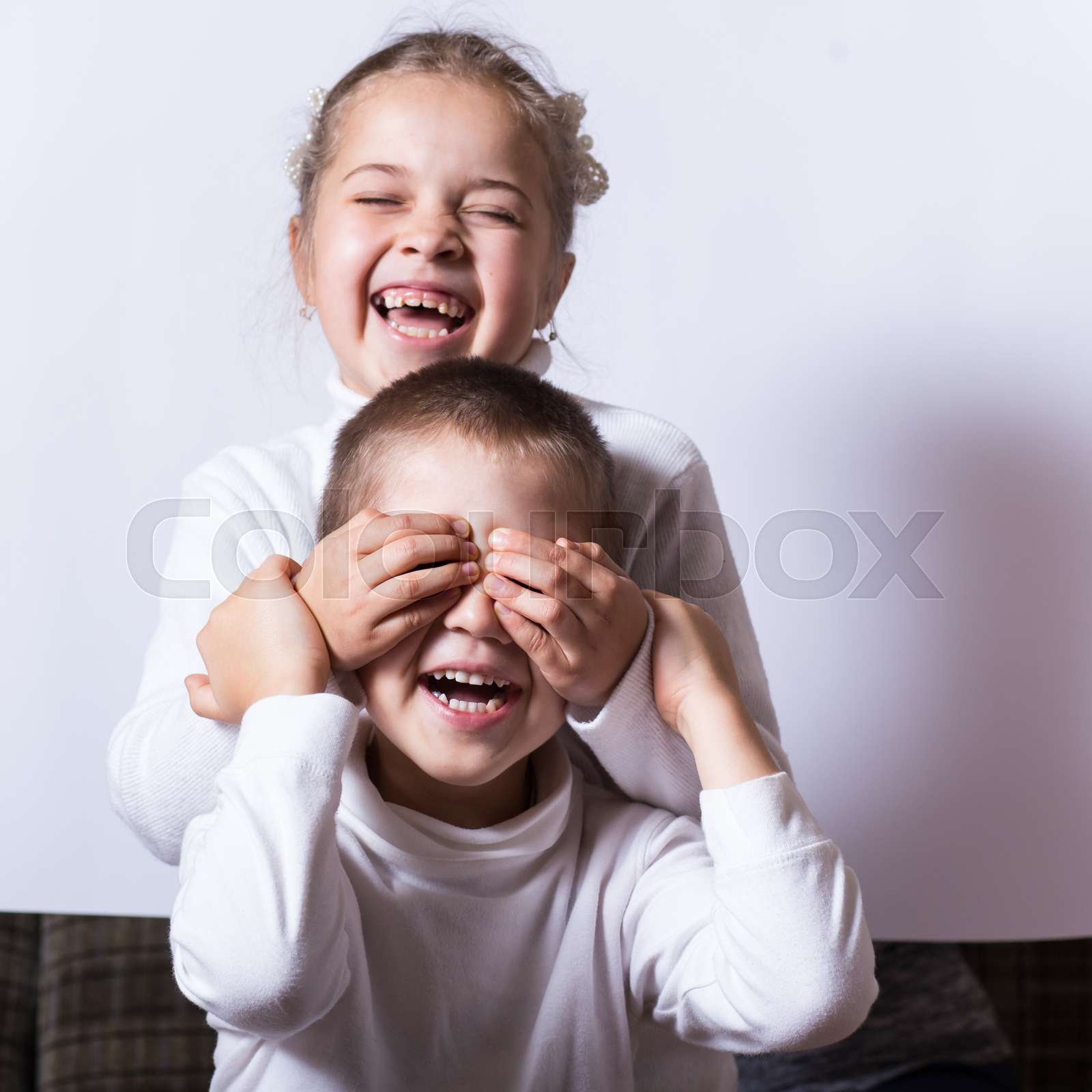 Happy kids surprise each other | Stock image | Colourbox