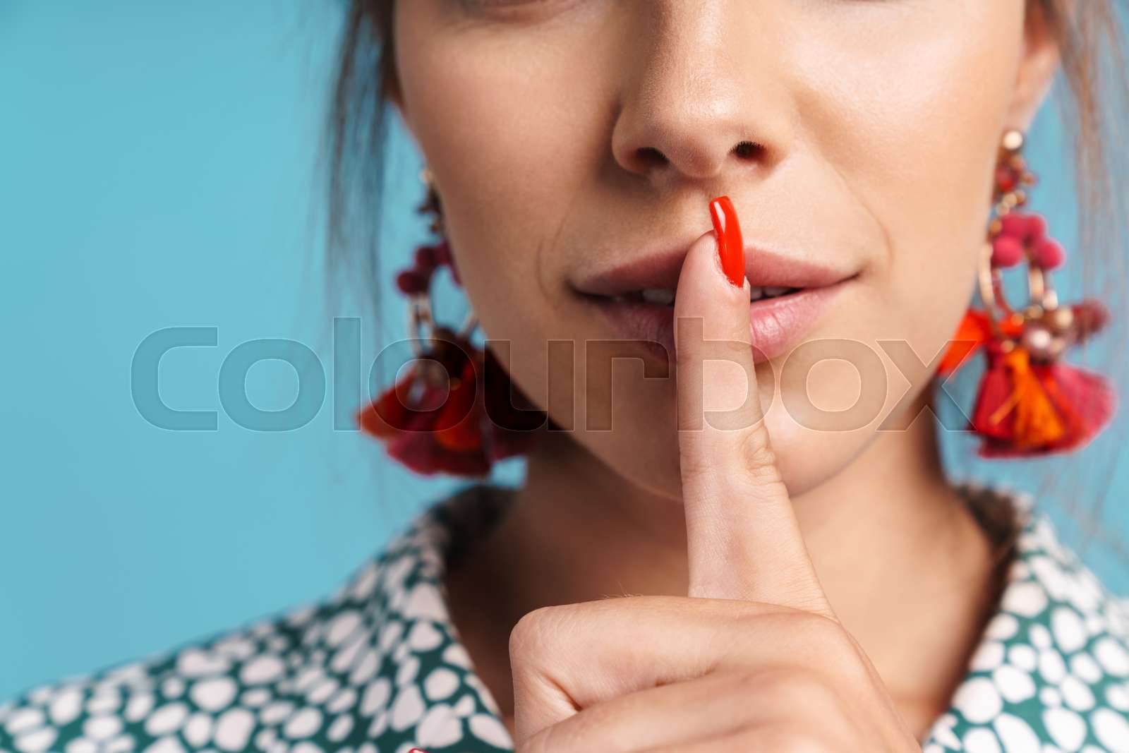 Close up of a young attractive girl wearing bright earrings | Stock ...