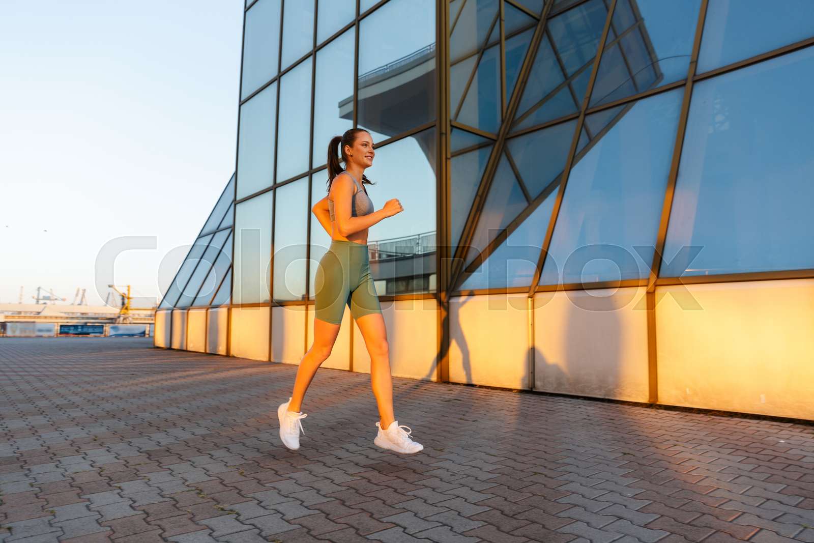 Attractive fit young sportsgirl jogging | Stock image | Colourbox