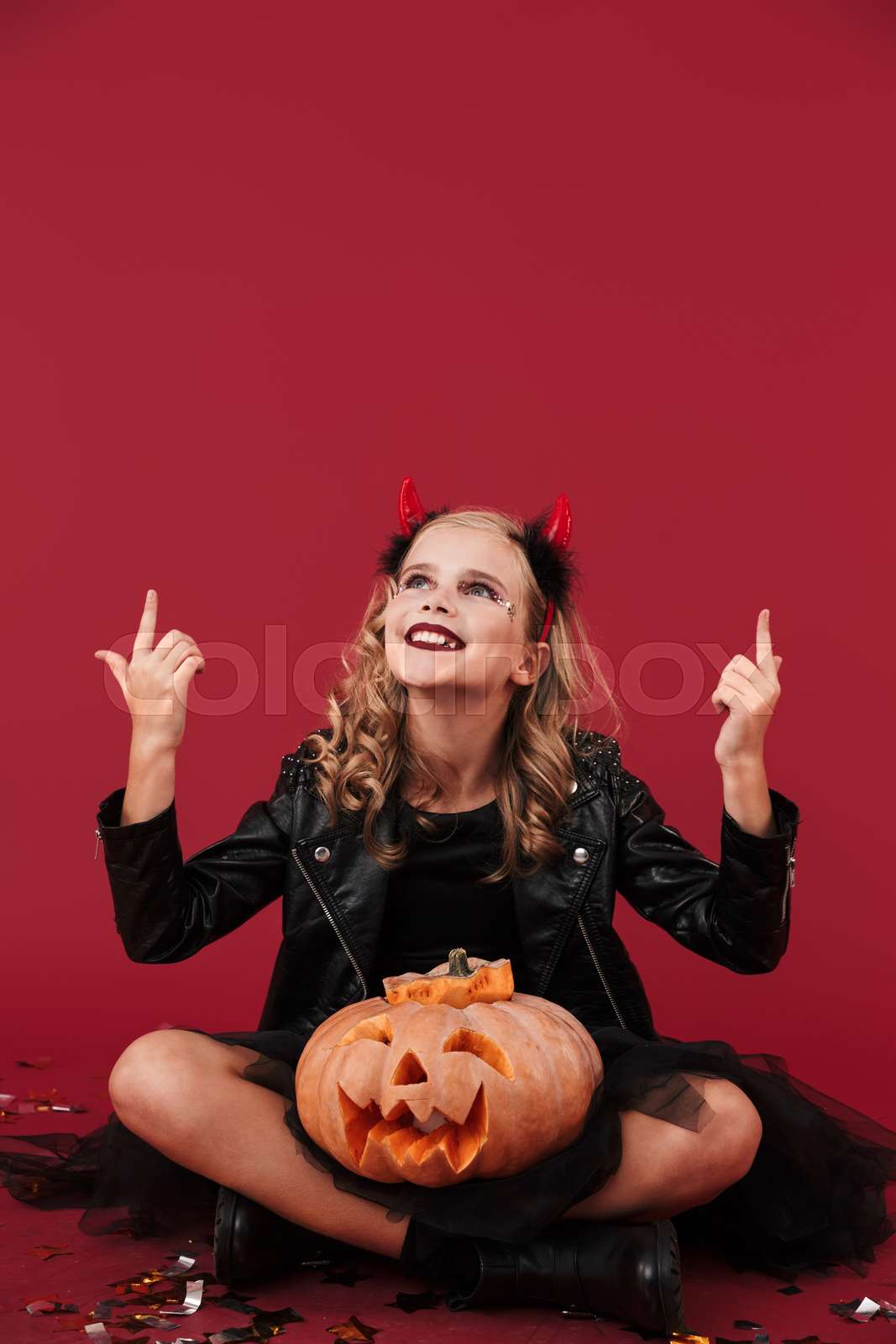 Little girl devil in carnival halloween costume | Stock image | Colourbox