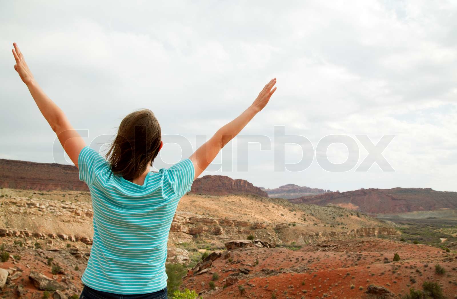 Woman with raised hands | Stock image | Colourbox