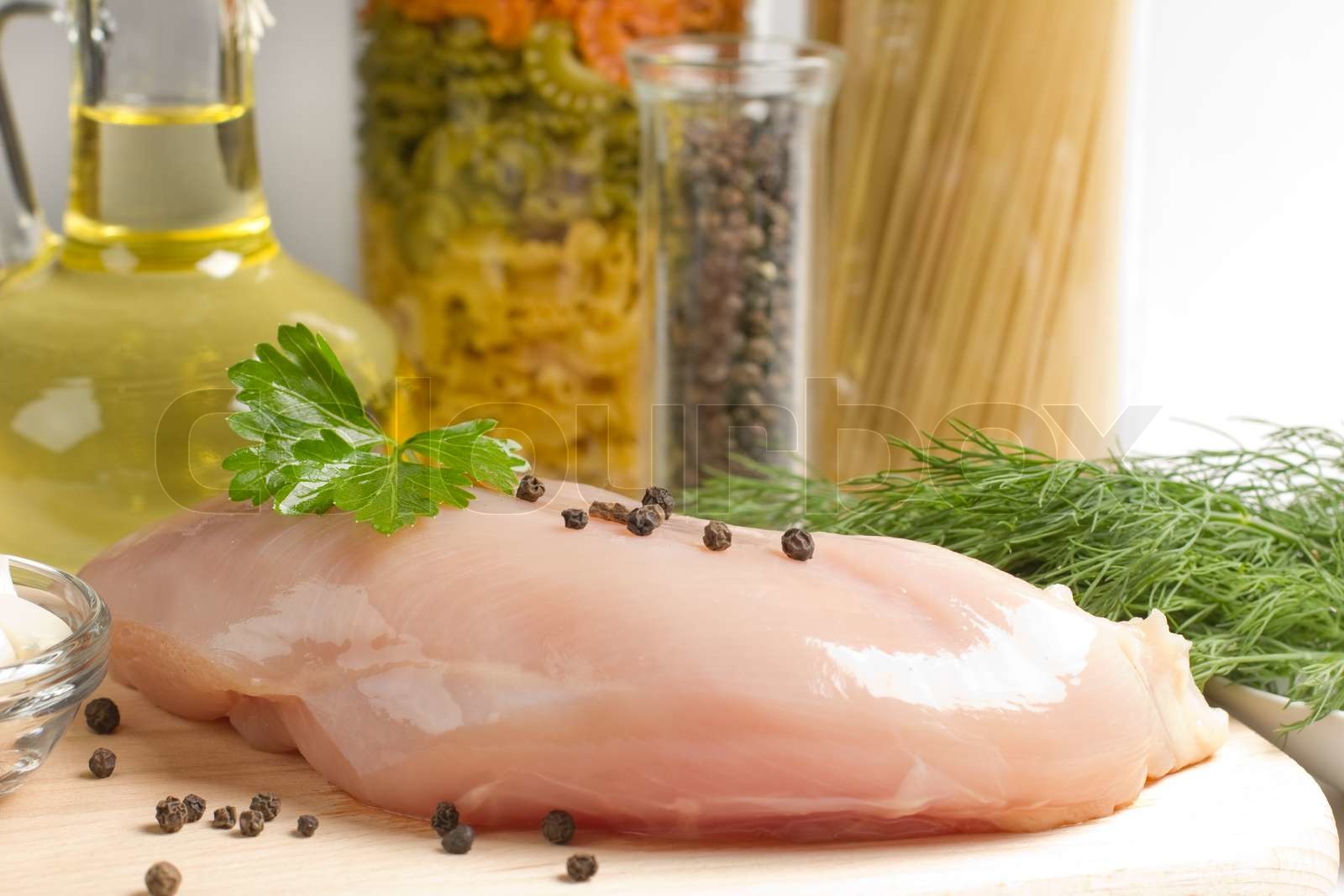 Preparation of raw chicken breast | Stock image | Colourbox