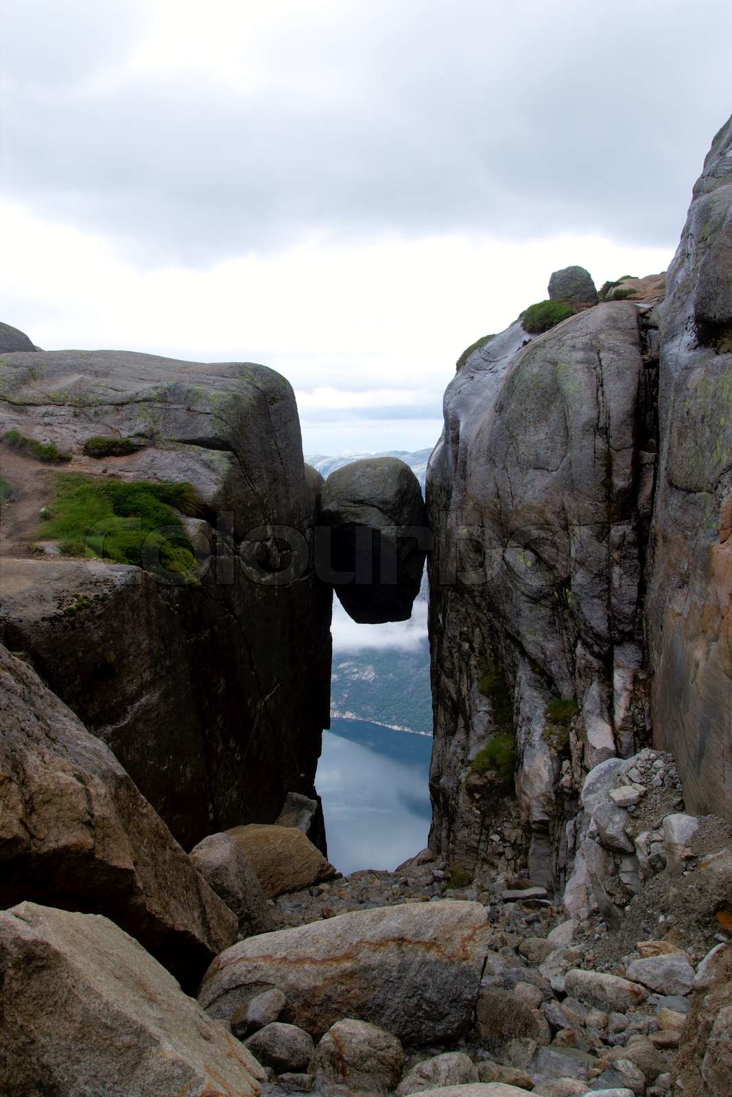 Kjeragbolten Norway the biggest stone between 2 rocks | Stock image ...