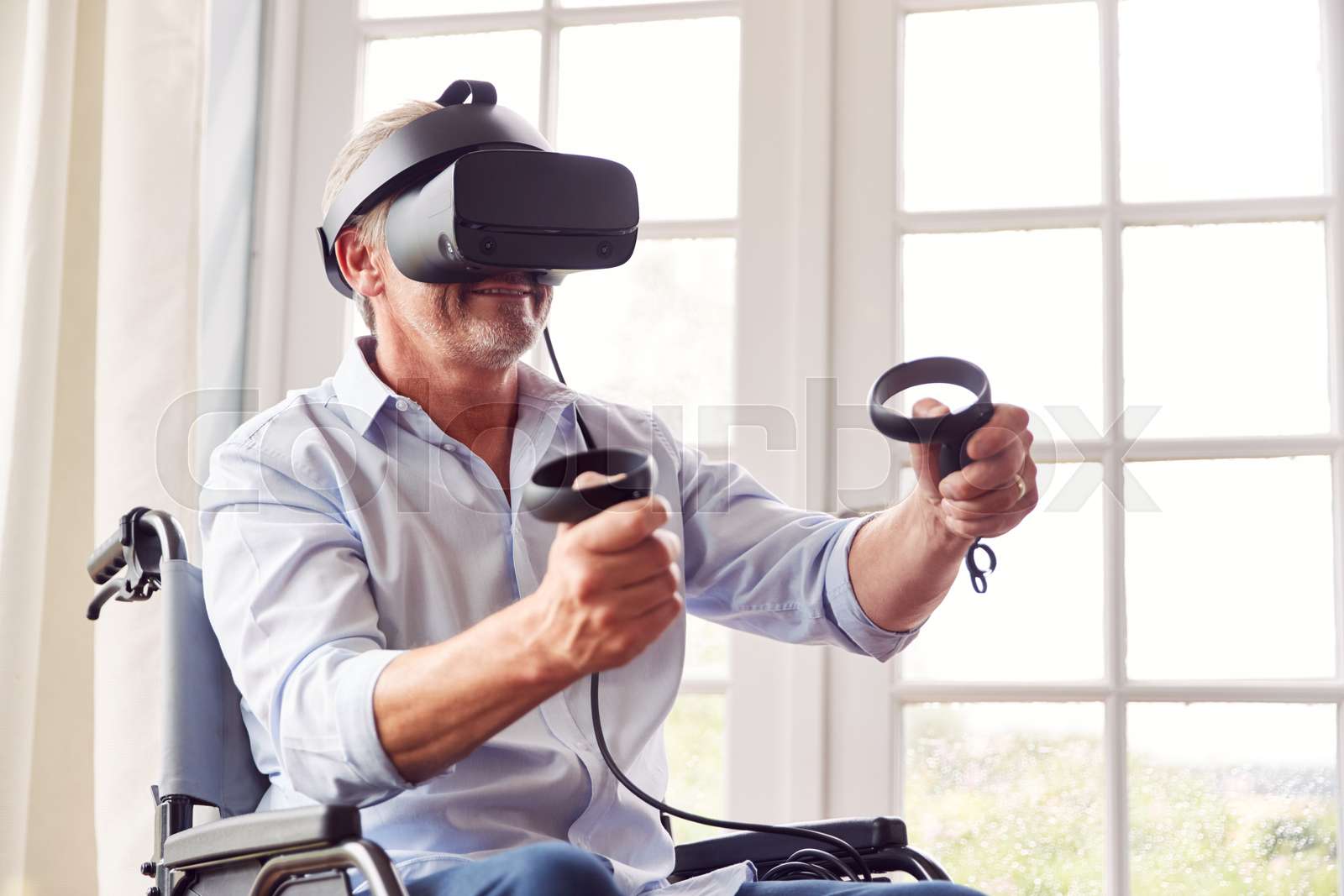 Mature Disabled Man In Wheelchair At Home Wearing Virtual Reality ...