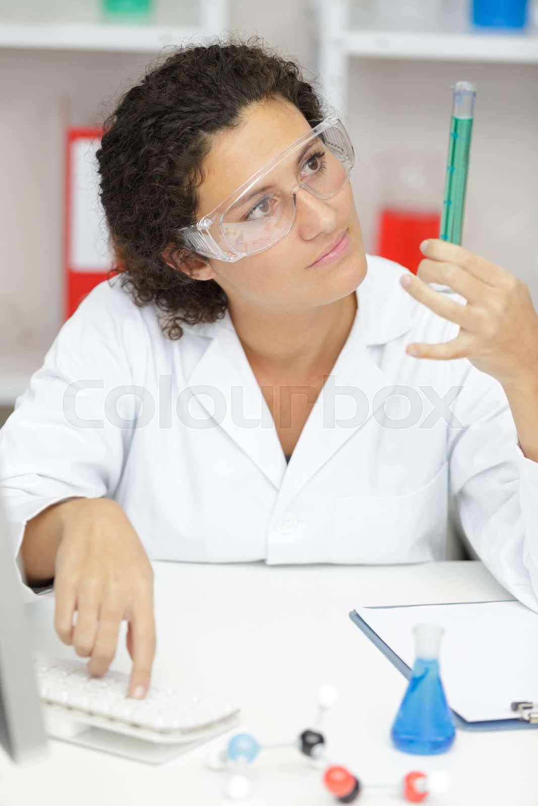 doctor in medical laboratory looking at blood test | Stock image ...