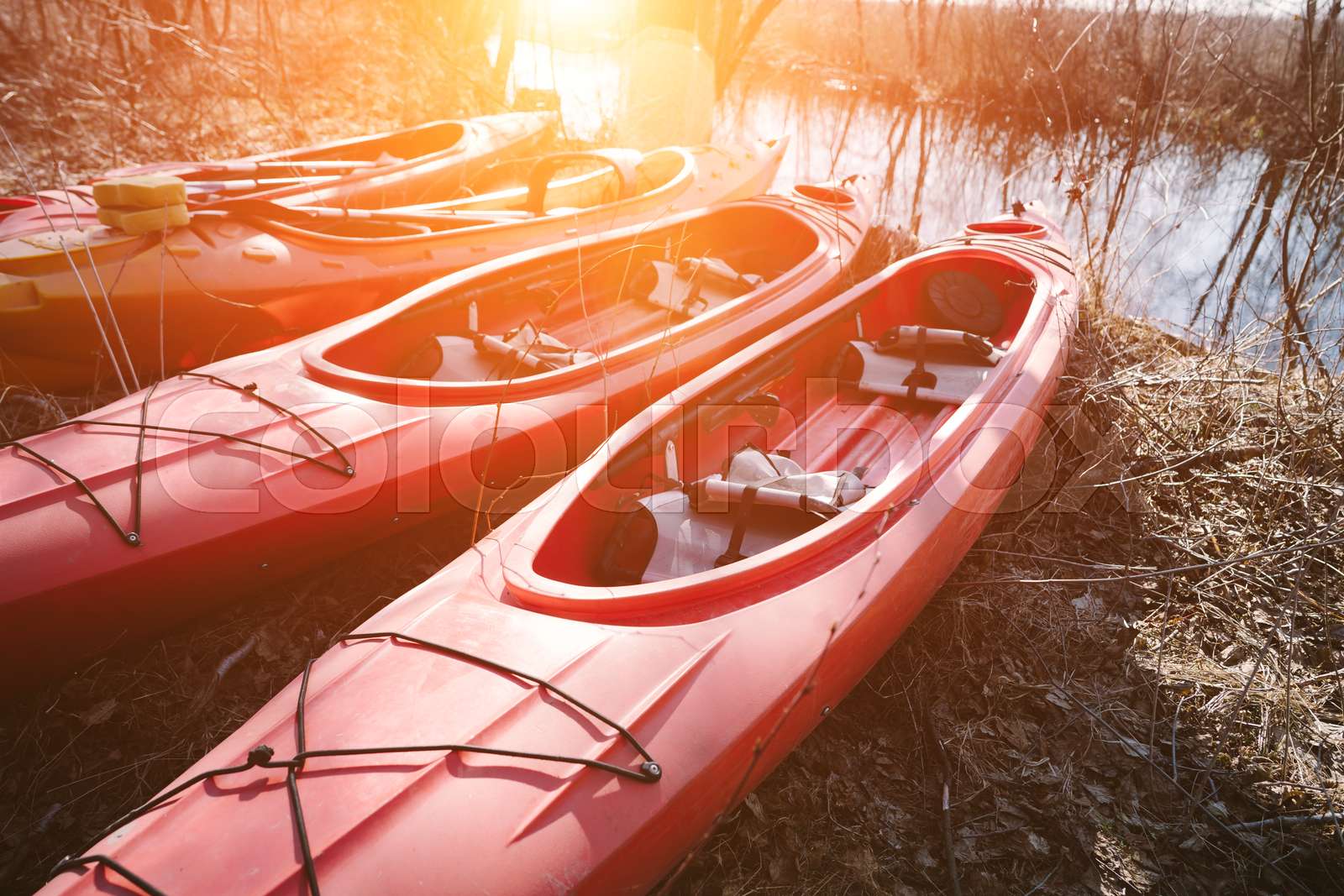 Group of canoes rental kayak on the lake shore beach | Stock image ...