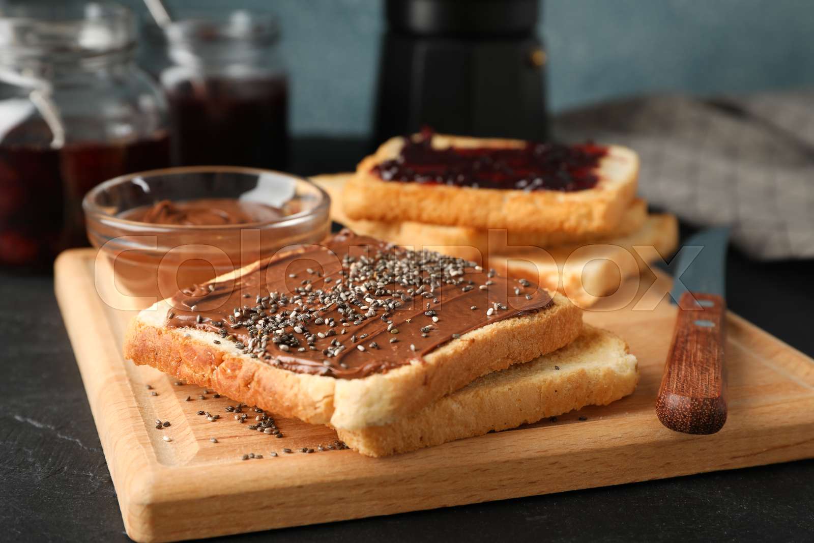 Concept of toasts with choco cream on wooden board, close up | Stock ...