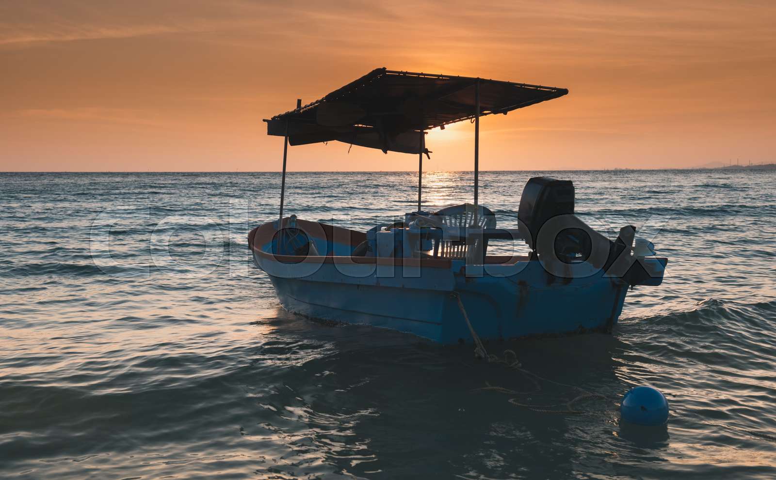 Wooden fishery boat floting on the sea. | Stock image | Colourbox