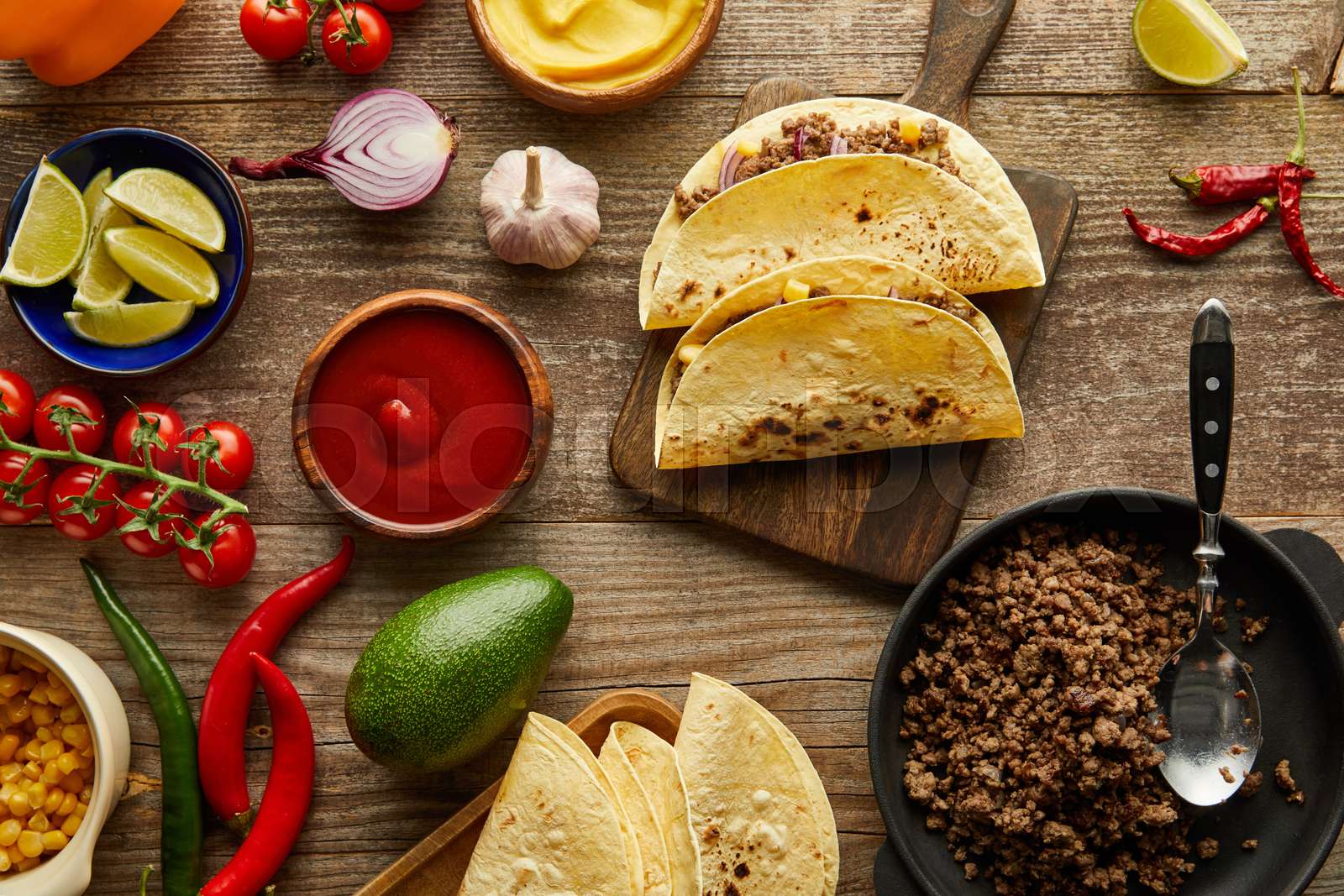 Top view of ingredients for traditional mexican tacos on wooden surface ...