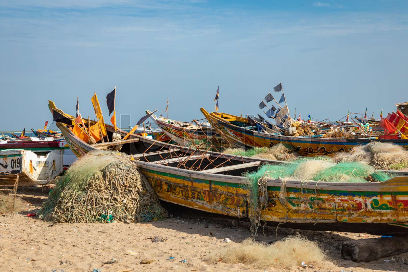 Traditional painted wooden fishing boat in Djiffer, Senegal. West ...