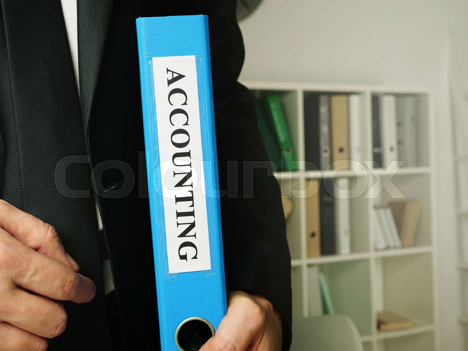 Accountant holds Business Accounting report in the blue folder. | Stock ...