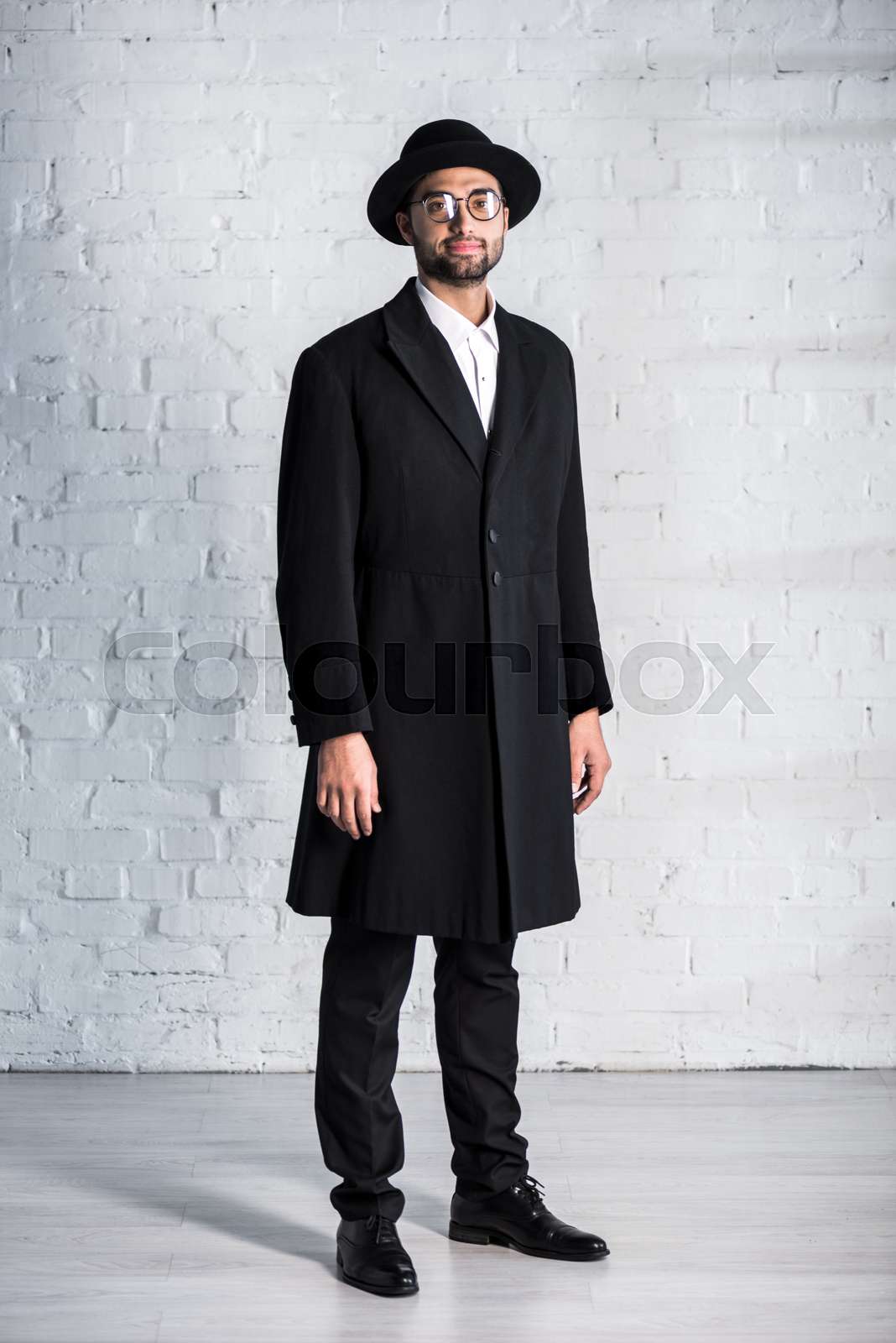 handsome and smiling jewish man in glasses looking at camera | Stock ...